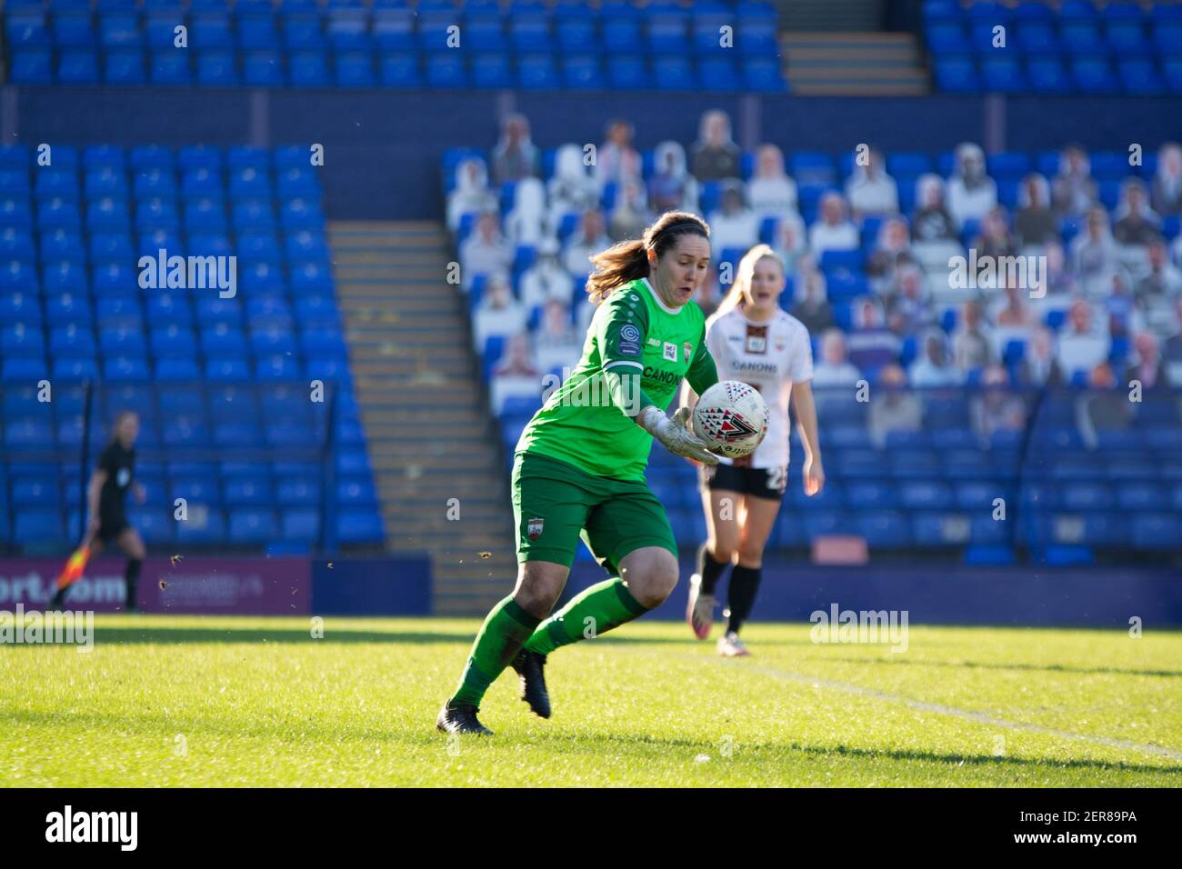 Birkenhead, UK. 28th Feb, 2021. Sarah Quantrill (#1 London Bees) clears ...