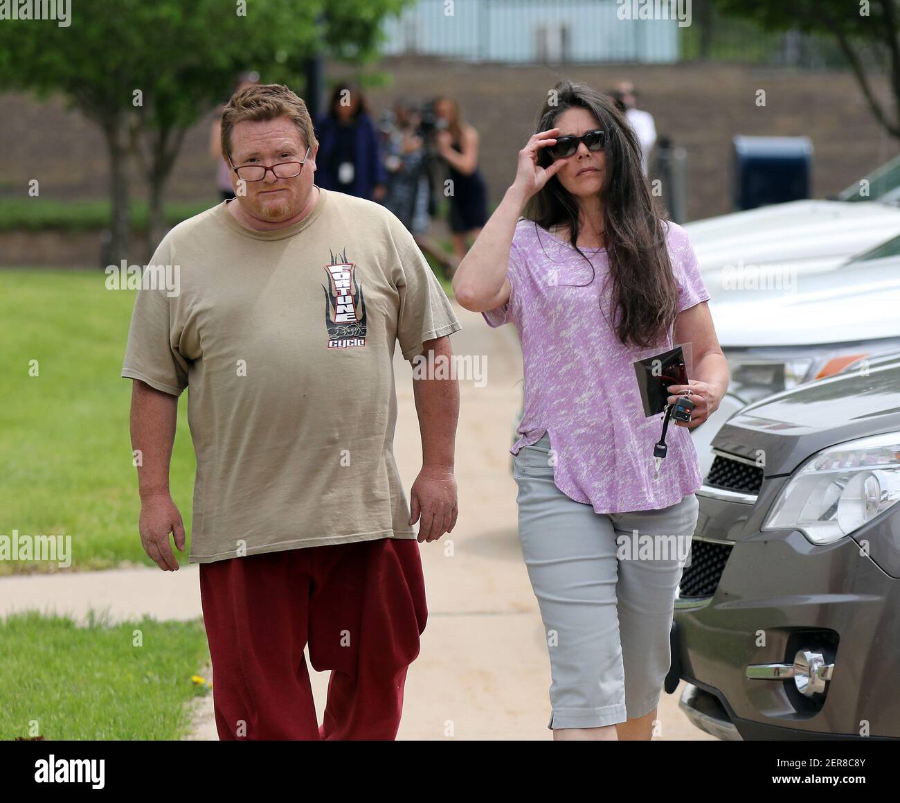 Matthew Milby, left, and Julie Milby leave the Lee County Courts ...