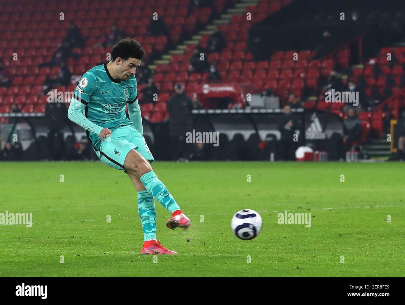 Liverpool's Curtis Jones scores their side's first goal of the game ...