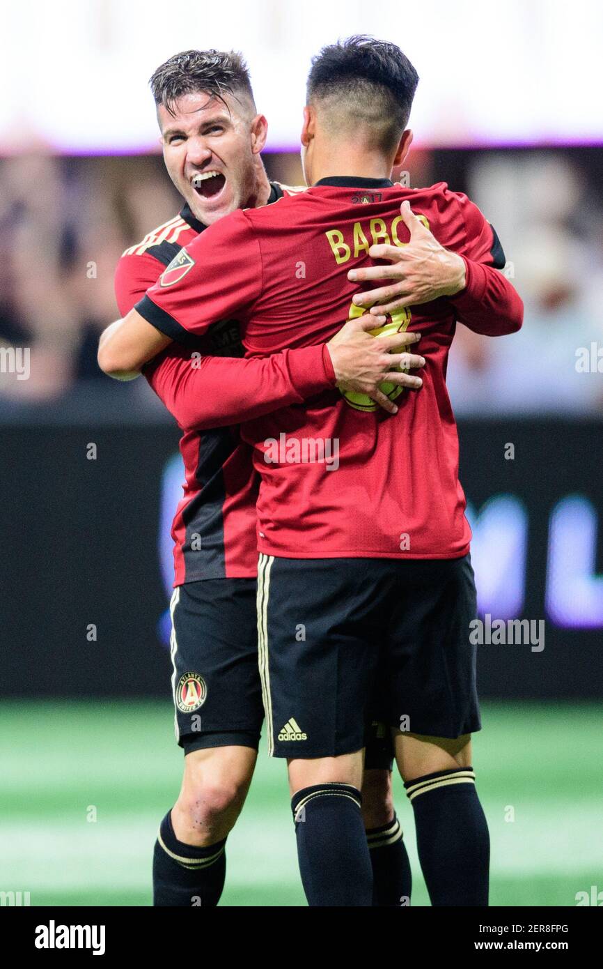 Atlanta United defender Greg Garza (4) and Atlanta United midfielder ...
