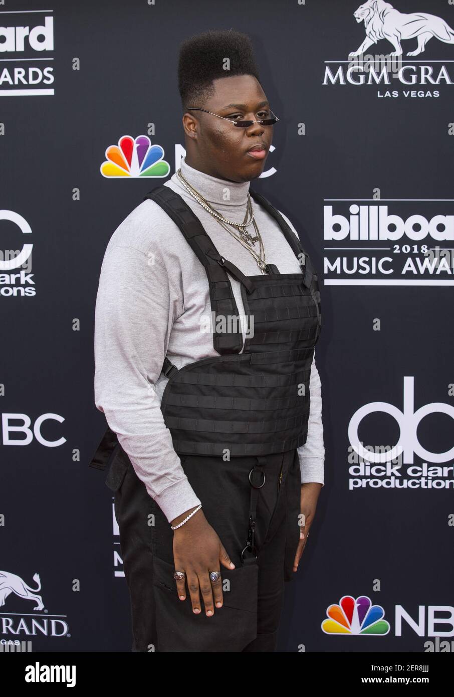 Influencer Denzel Dion walking on the red carpet at the 2018 Billboard ...
