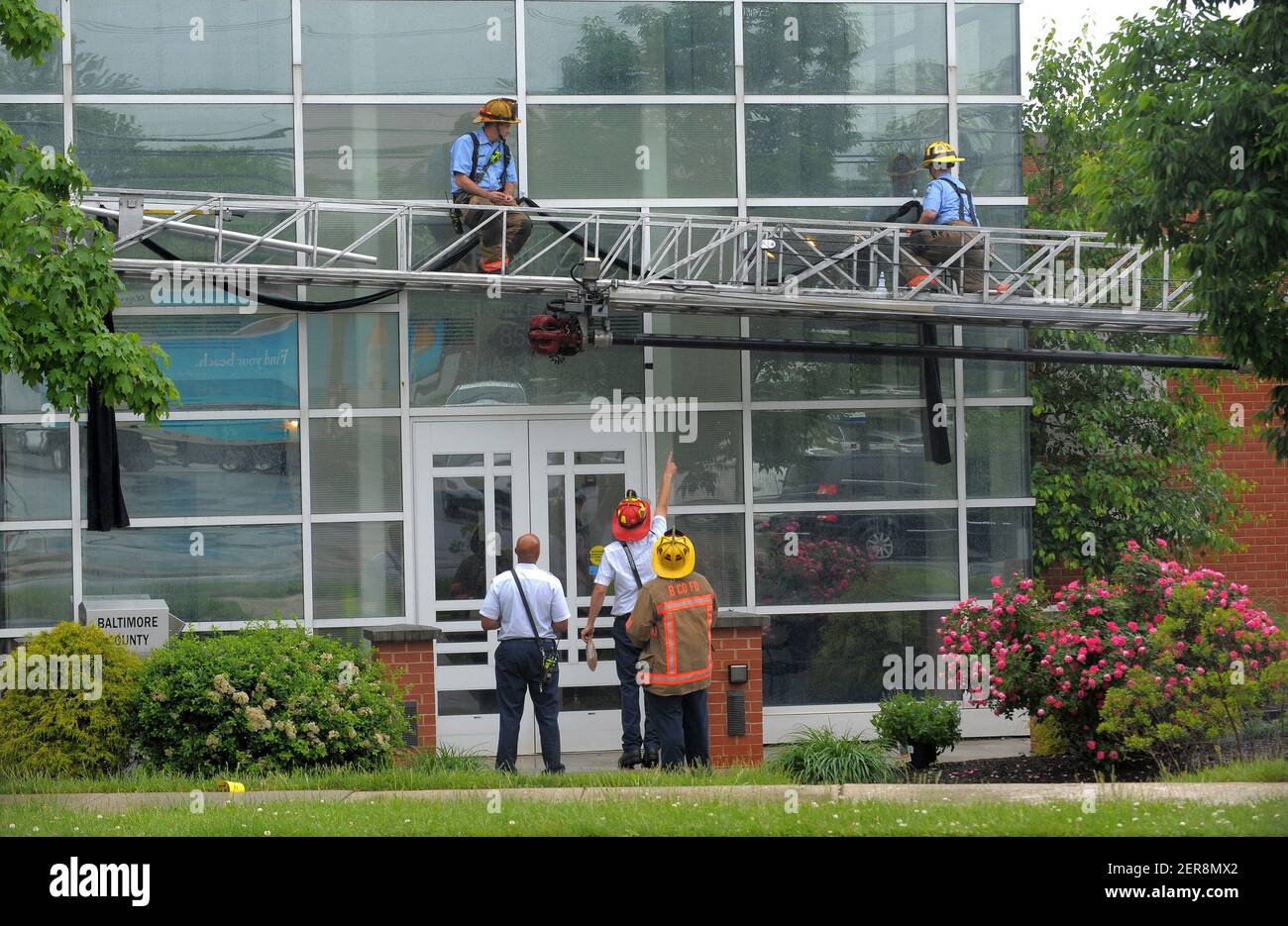 Firefighters hang black bunting on Precinct Eight Parkville Station ...
