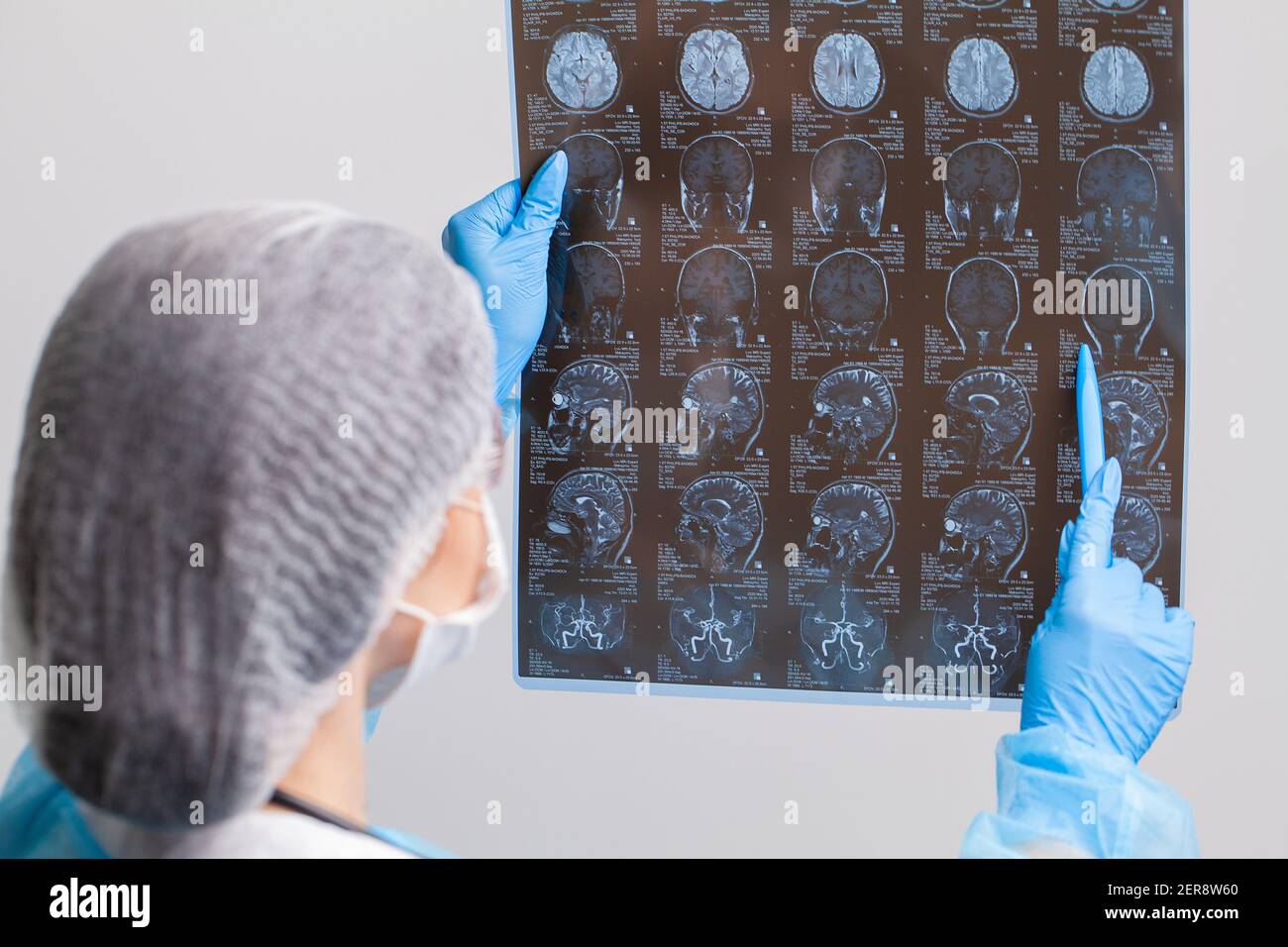 Beautiful female radiologist looking at the MRI scan images Stock Photo ...