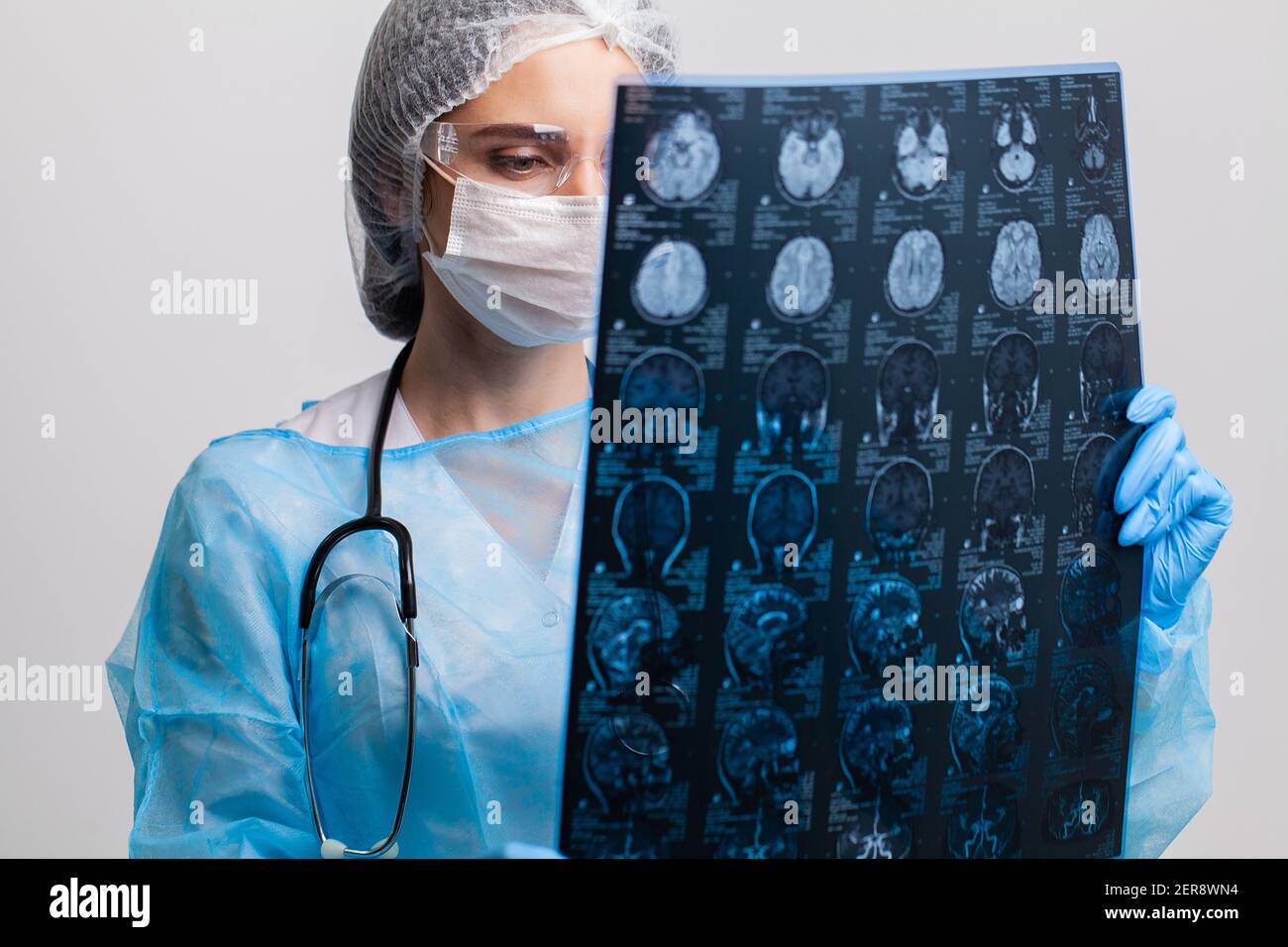 Doctor examining x ray images of patient hi-res stock photography and ...