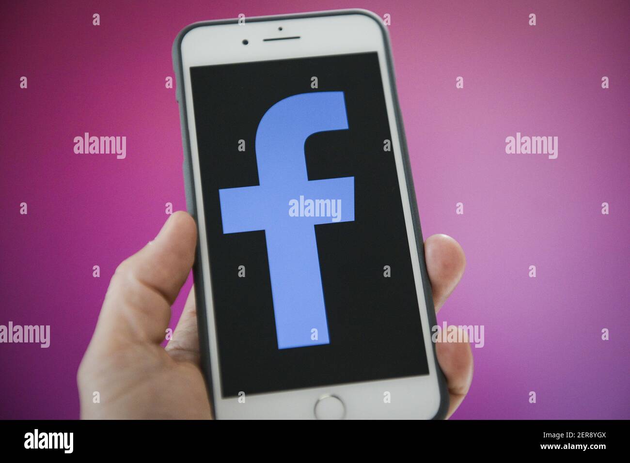 The Facebook logo is seen on an iPhone 8 plus in this photo ...