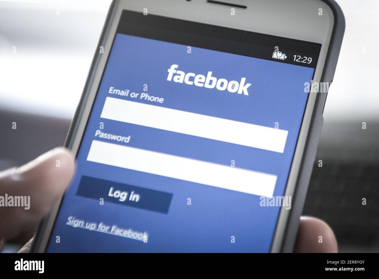 The Facebook logo is seen on an iPhone 8 plus in this photo ...