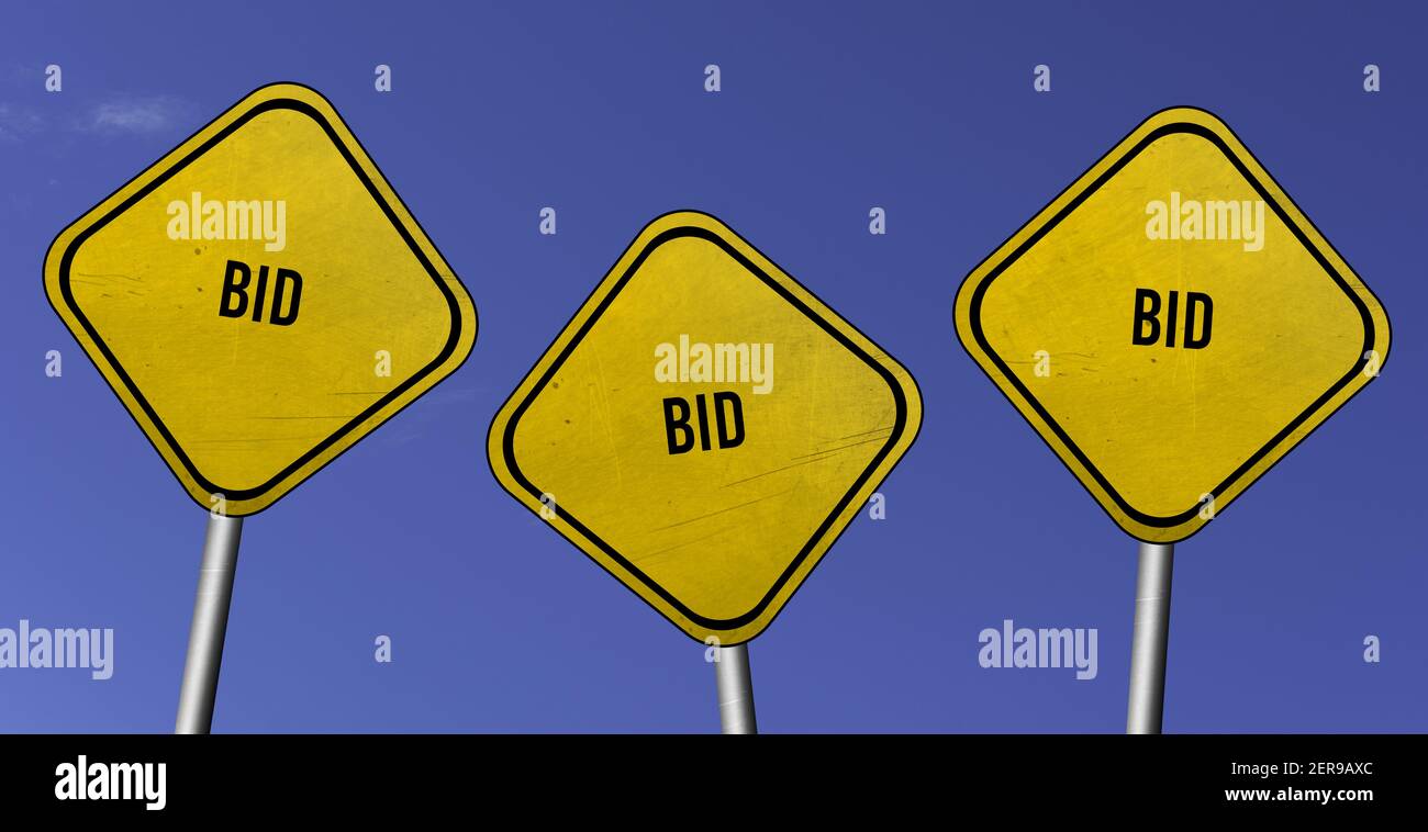 Bid - three yellow signs with blue sky background Stock Photo - Alamy