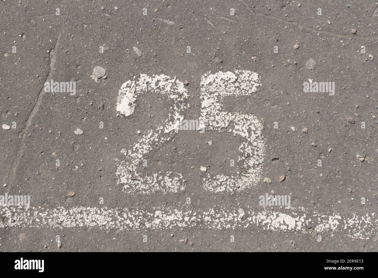 Number 25, twenty five, painted on asphalt, running track Stock Photo ...