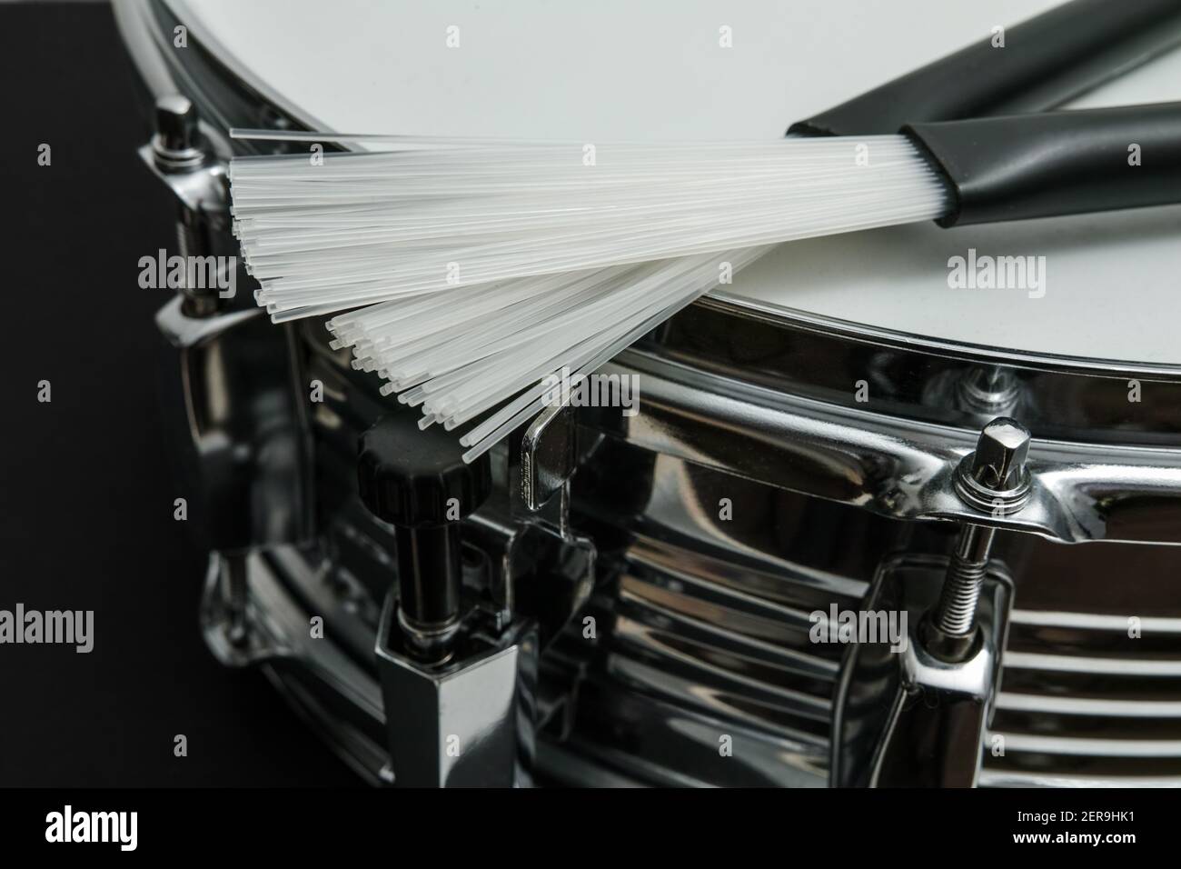 A steel snare and plastic telescoping brushes Stock Photo - Alamy