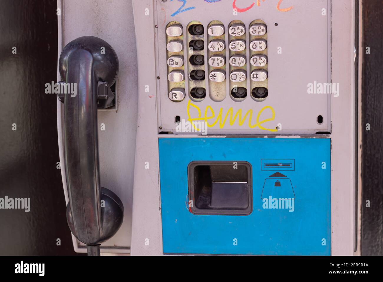 old public phone with broken keypad Stock Photo - Alamy