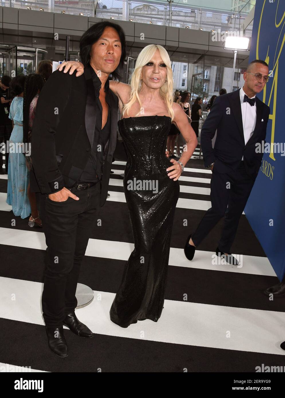 Stephen Gan, Donatella Versace at cocktail reception during the 2018 ...