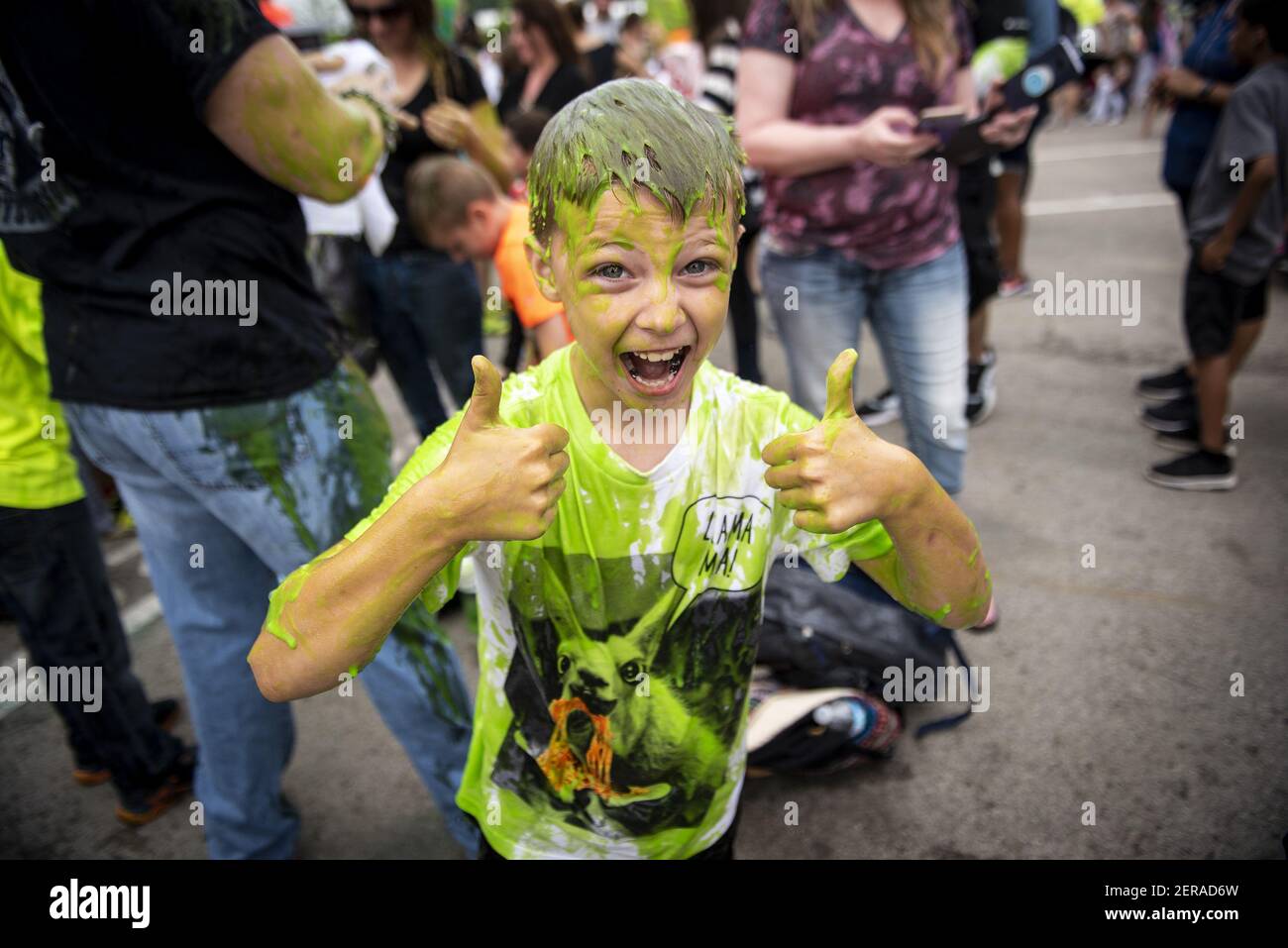 An attendee is covered in "slime" at the Nickelodeon SlimeFest on ...