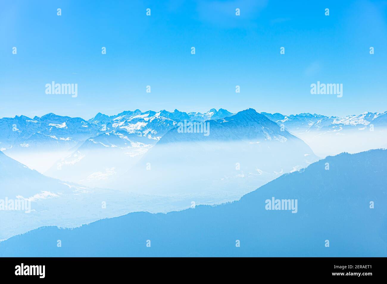 Unique panoramic alpine skyline aerial landscape view of misty iced ...