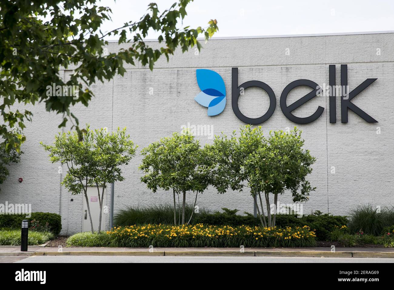 A logo sign outside of a Belk retail store in Fredericksburg, Virginia ...