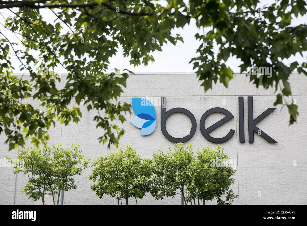A logo sign outside of a Belk retail store in Fredericksburg, Virginia ...