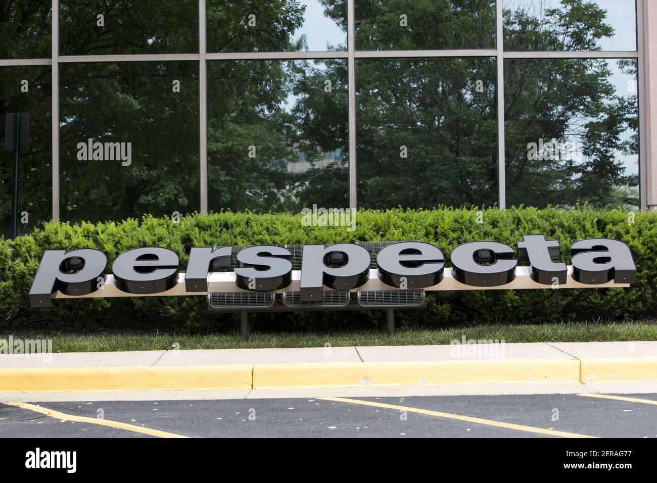 A logo sign outside of a facility occupied by Perspecta in Chantilly ...