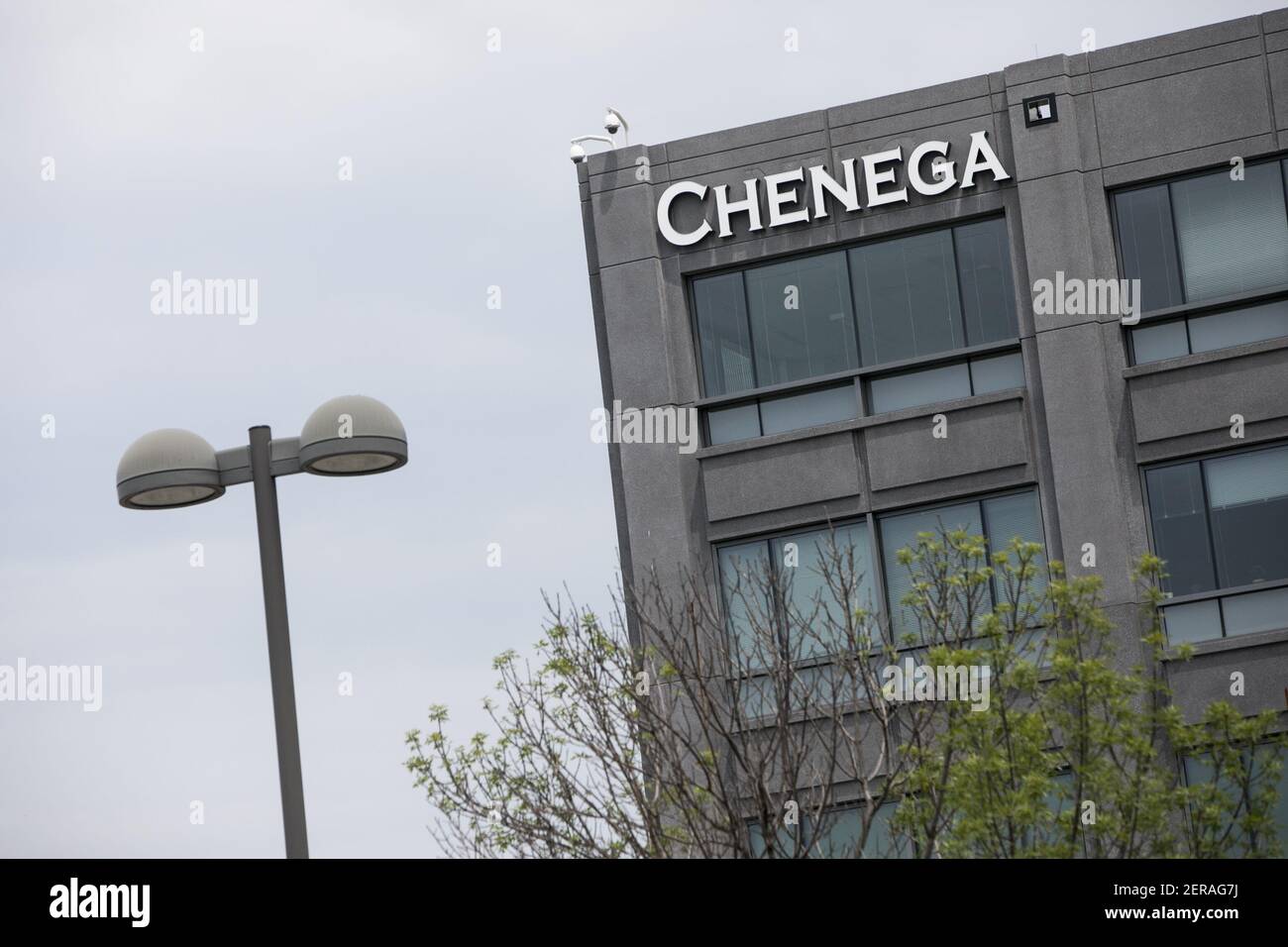 A logo sign outside of a facility occupied by the Chenega Corporation ...