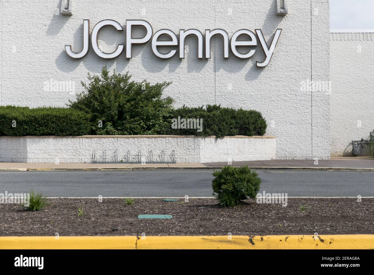 A logo sign outside of a JCPenney retail store in Fredericksburg ...