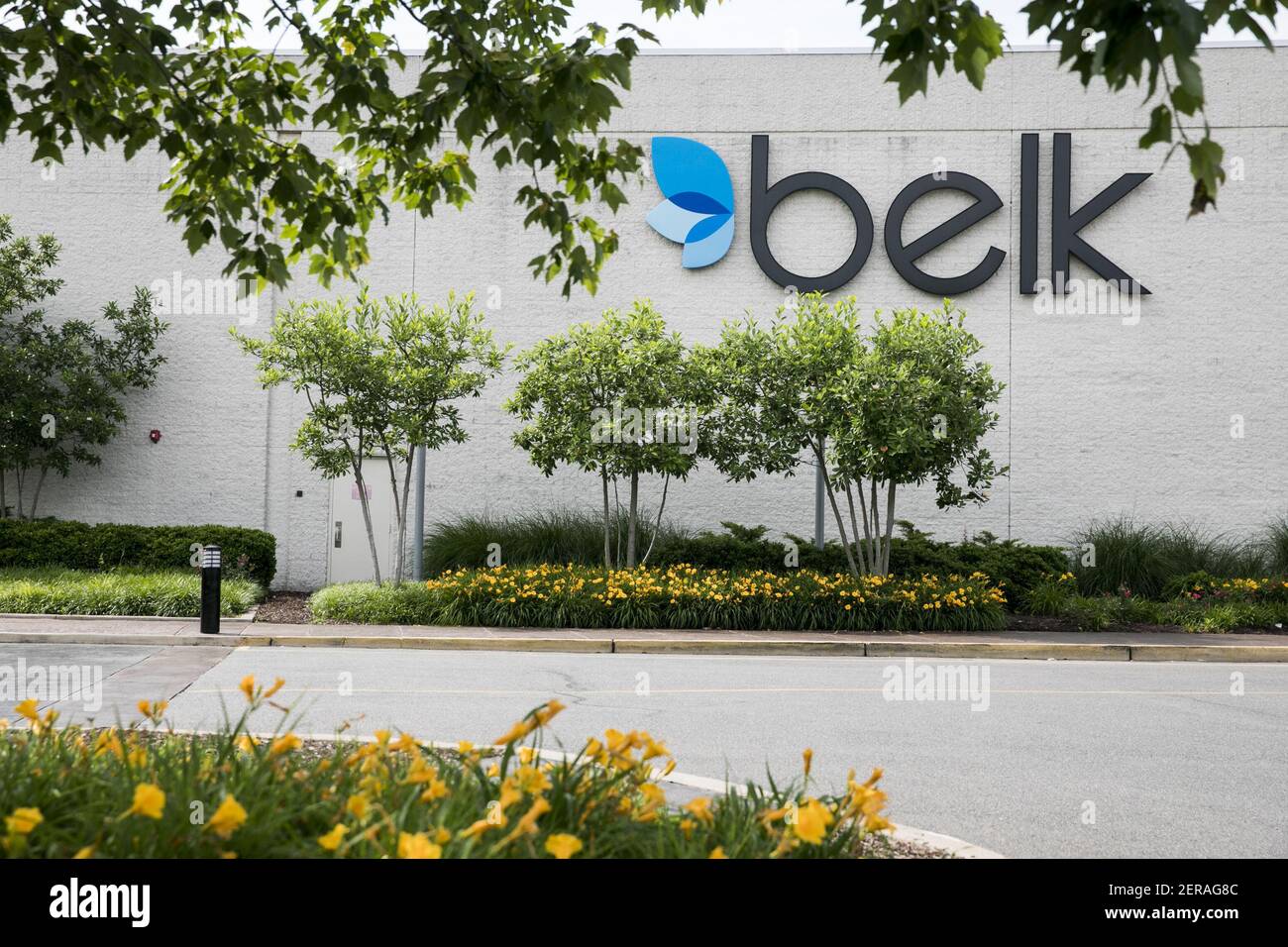 A logo sign outside of a Belk retail store in Fredericksburg, Virginia ...