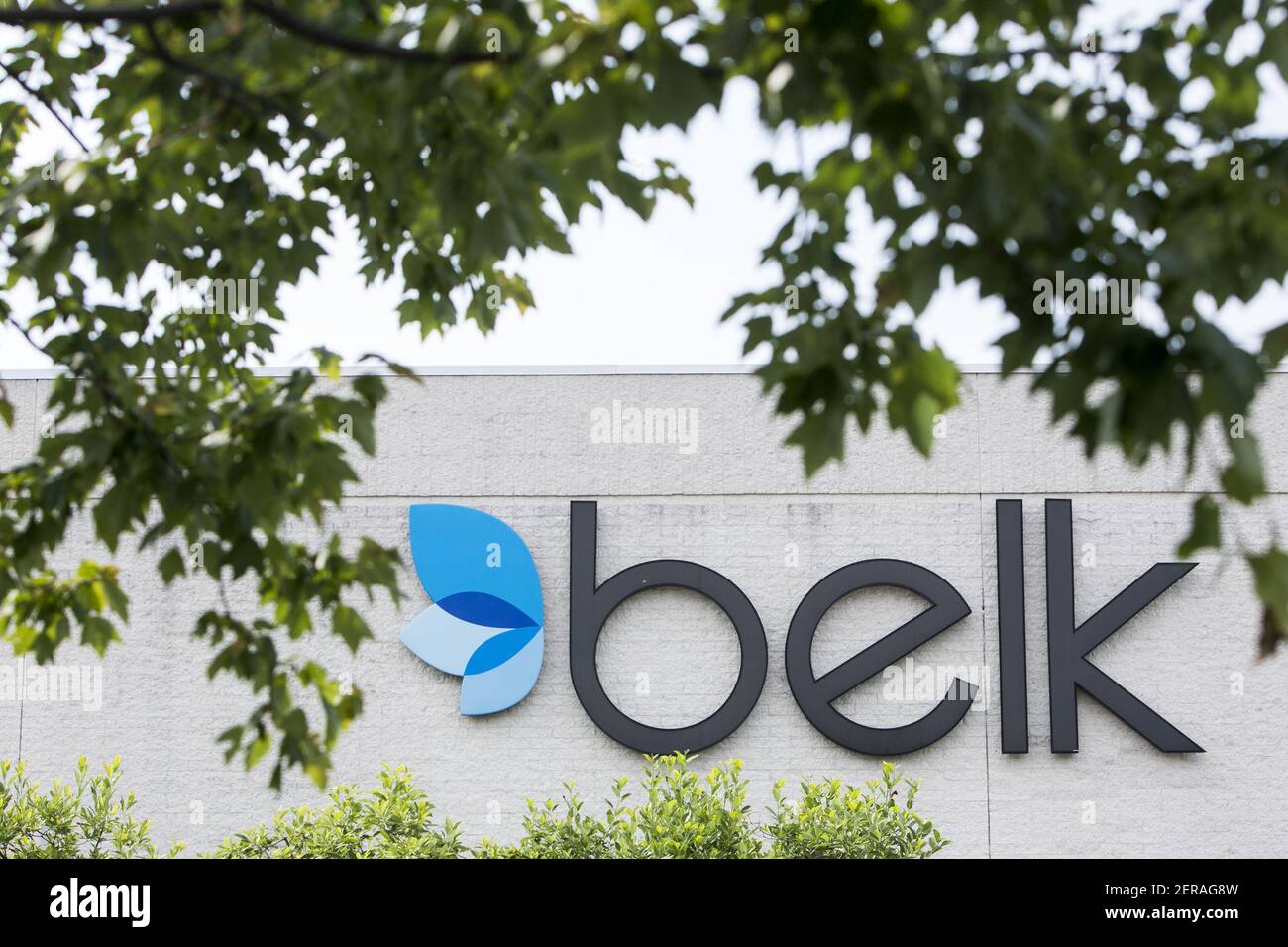 A logo sign outside of a Belk retail store in Fredericksburg, Virginia ...