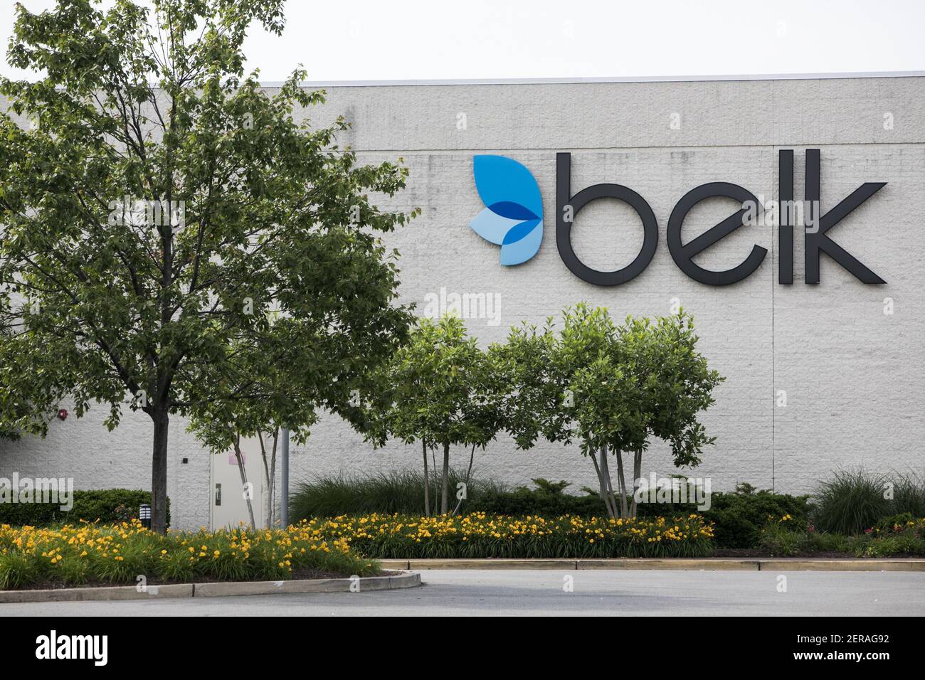A logo sign outside of a Belk retail store in Fredericksburg, Virginia ...