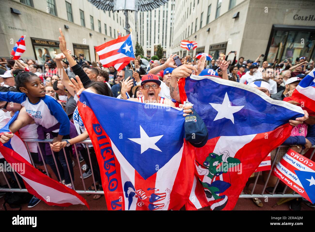 People line the Fifth Avenue to celebrate NYC's Puerto Rico Day parade ...