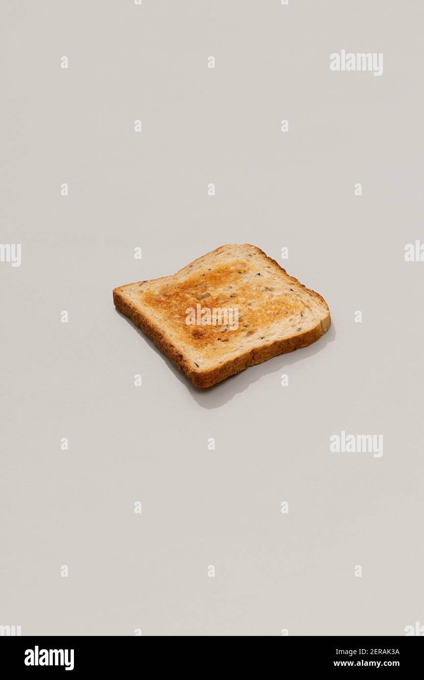 Fresh toasted bread on gray background with sunlight Stock Photo - Alamy