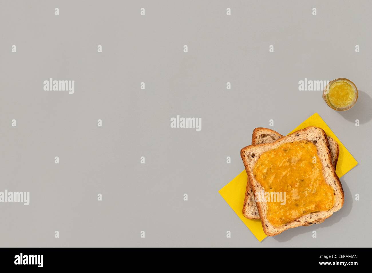 Toast with lemon jam on gray background Stock Photo - Alamy