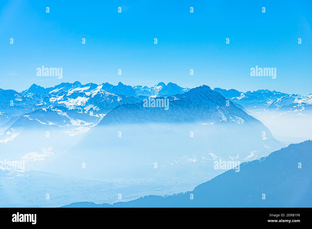 Unique panoramic alpine skyline aerial landscape view of misty iced ...