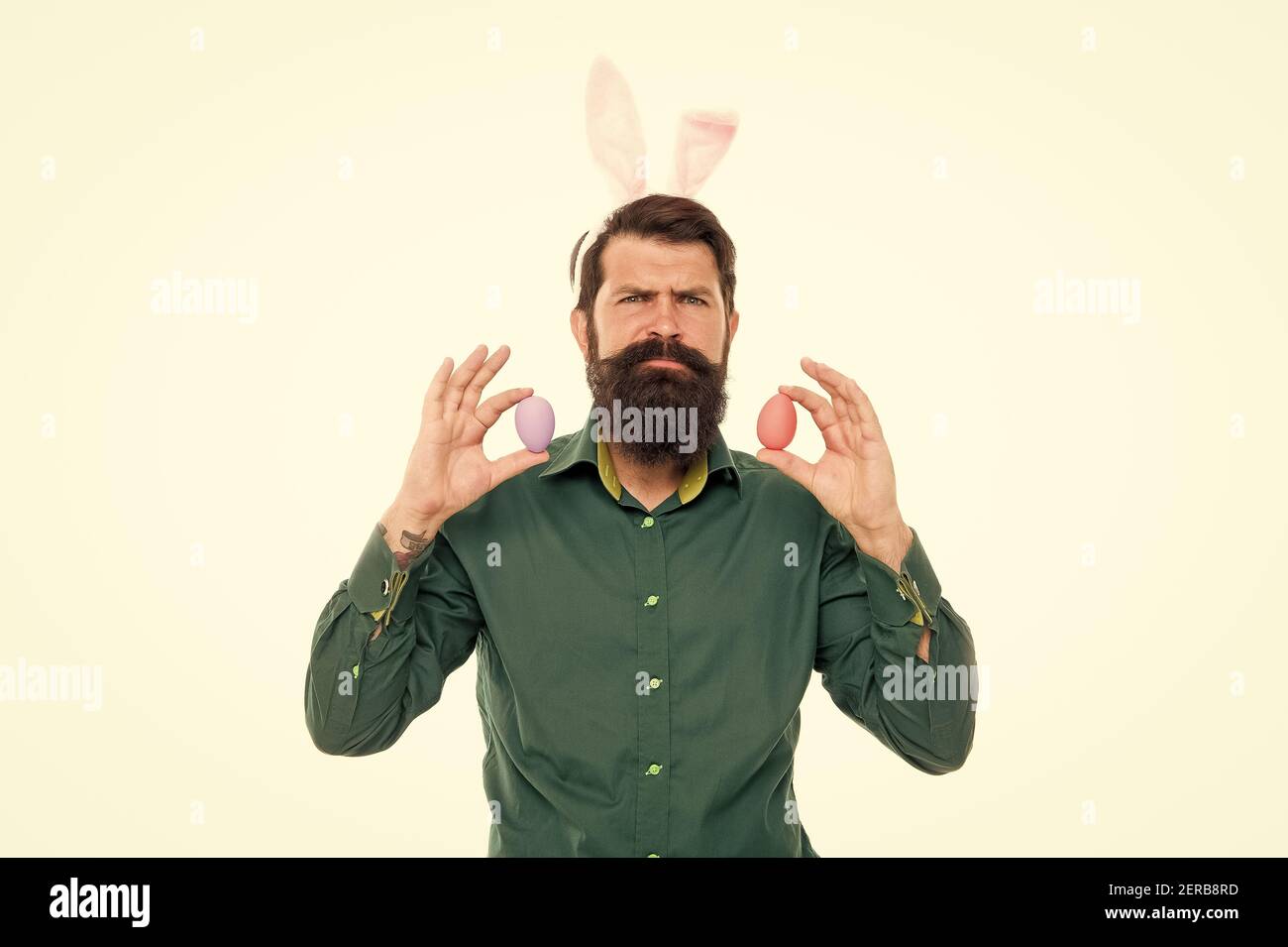 Seasonal goods. Celebration of spring holiday. Bearded man with bunny ...