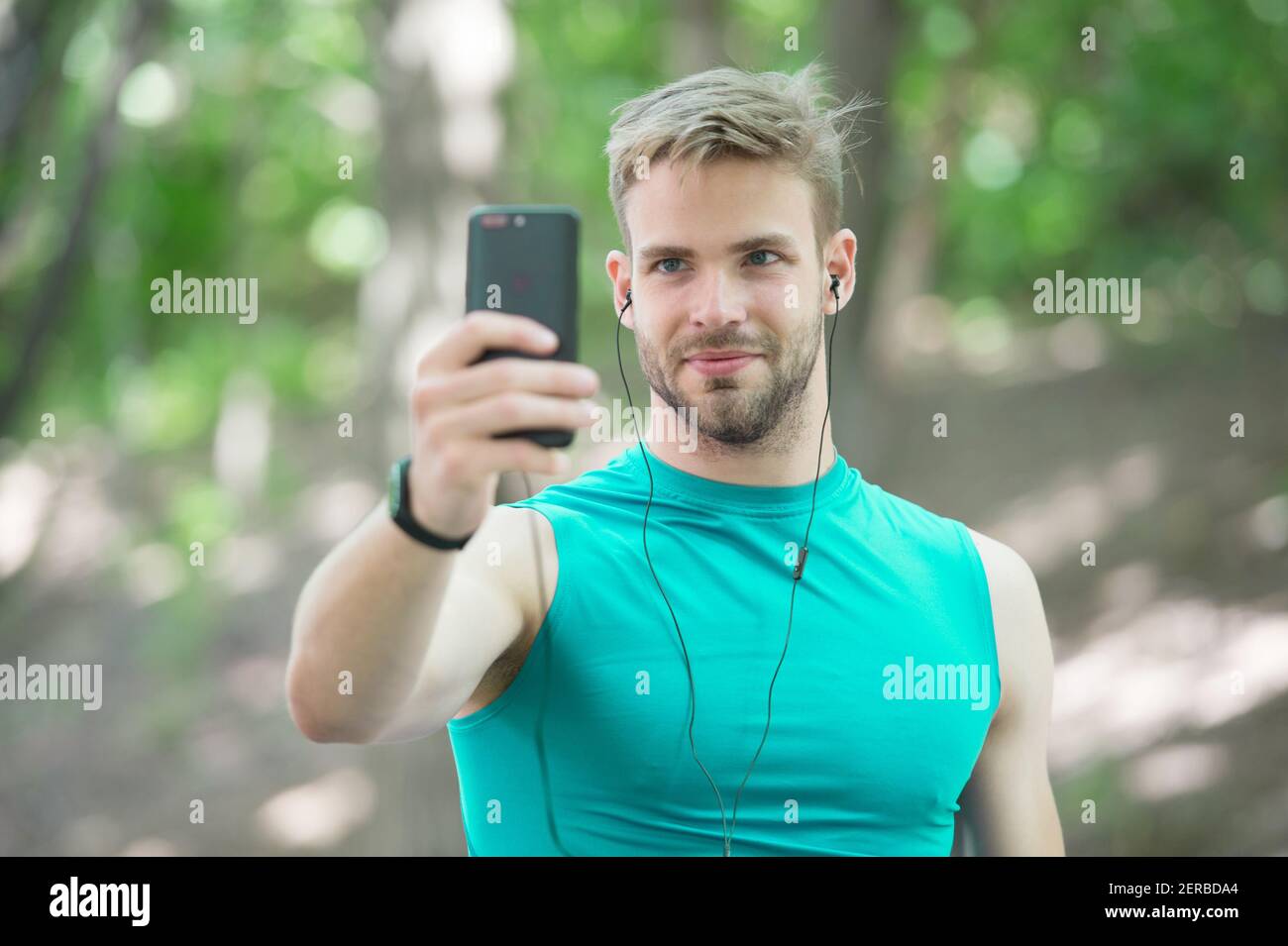 sport app on phone. digital sport. smart watch. athletic man in ...