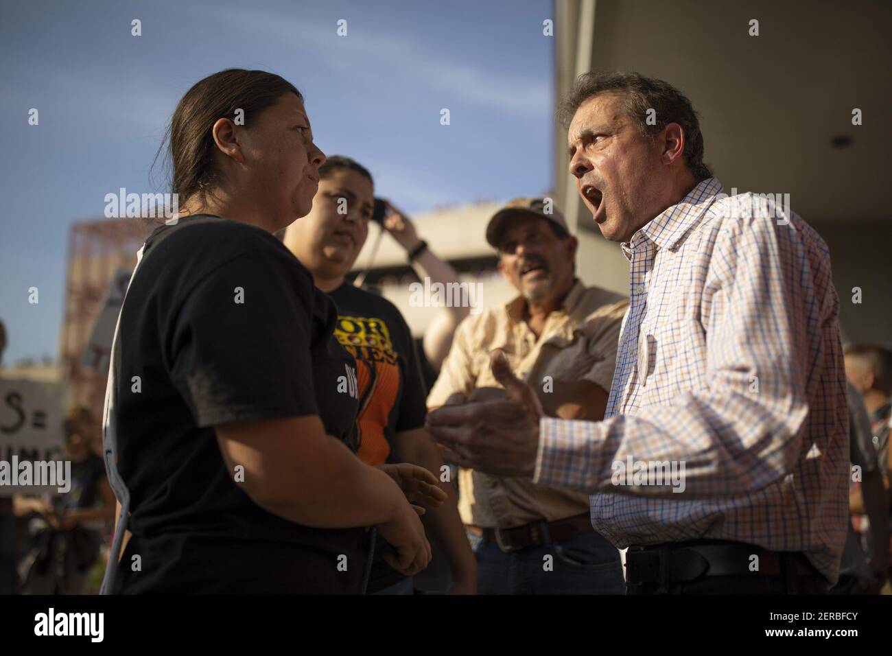 Aaron Camacho, left, and Pastor Dan Stone of Duluth, Minn. discuss ...