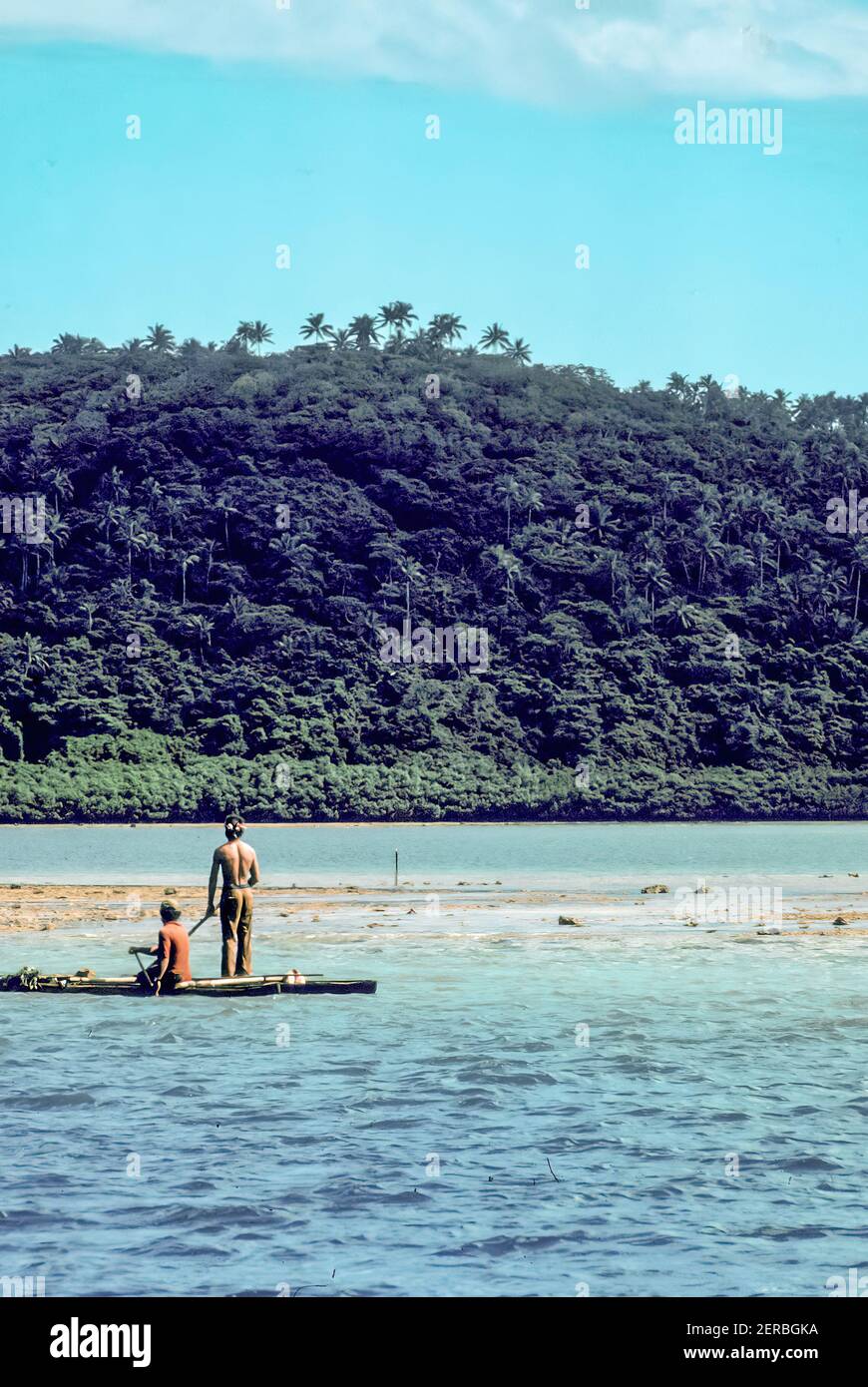 Two native fisherman in a canoe in a lagoon in Tonga Stock Photo - Alamy