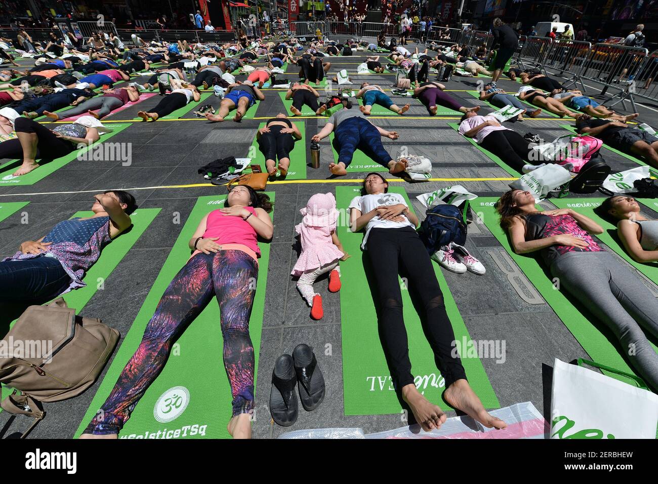 One year-old Nanami crawls up to her mother Mika Kadakoshi (R) as they ...