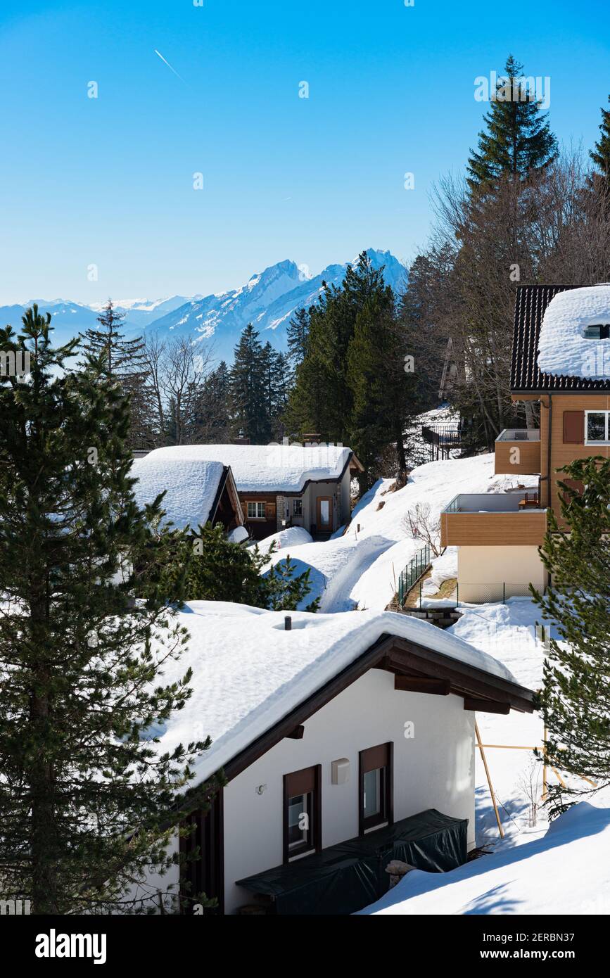 Unique panoramic alpine skyline view of Rigi resort. Snowed Chalets ...
