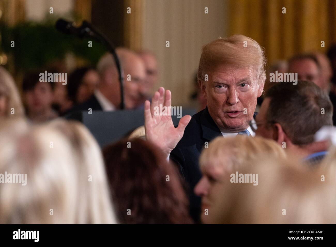 U.S. President Donald Trump talks to guests after he posthumously ...
