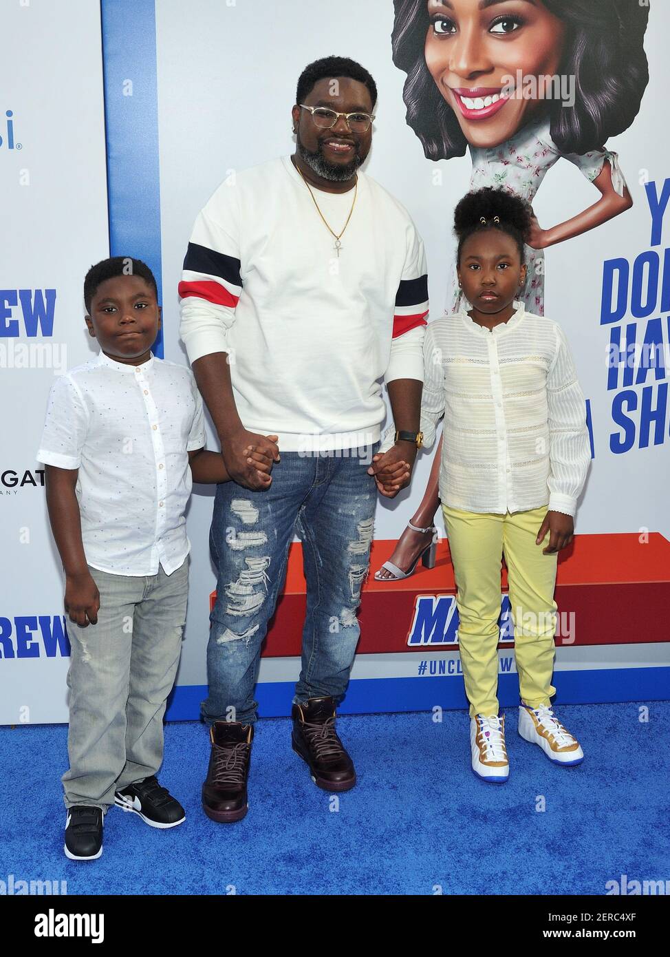 Actor Lil Rey Howery and children attend the world premiere of Uncle ...