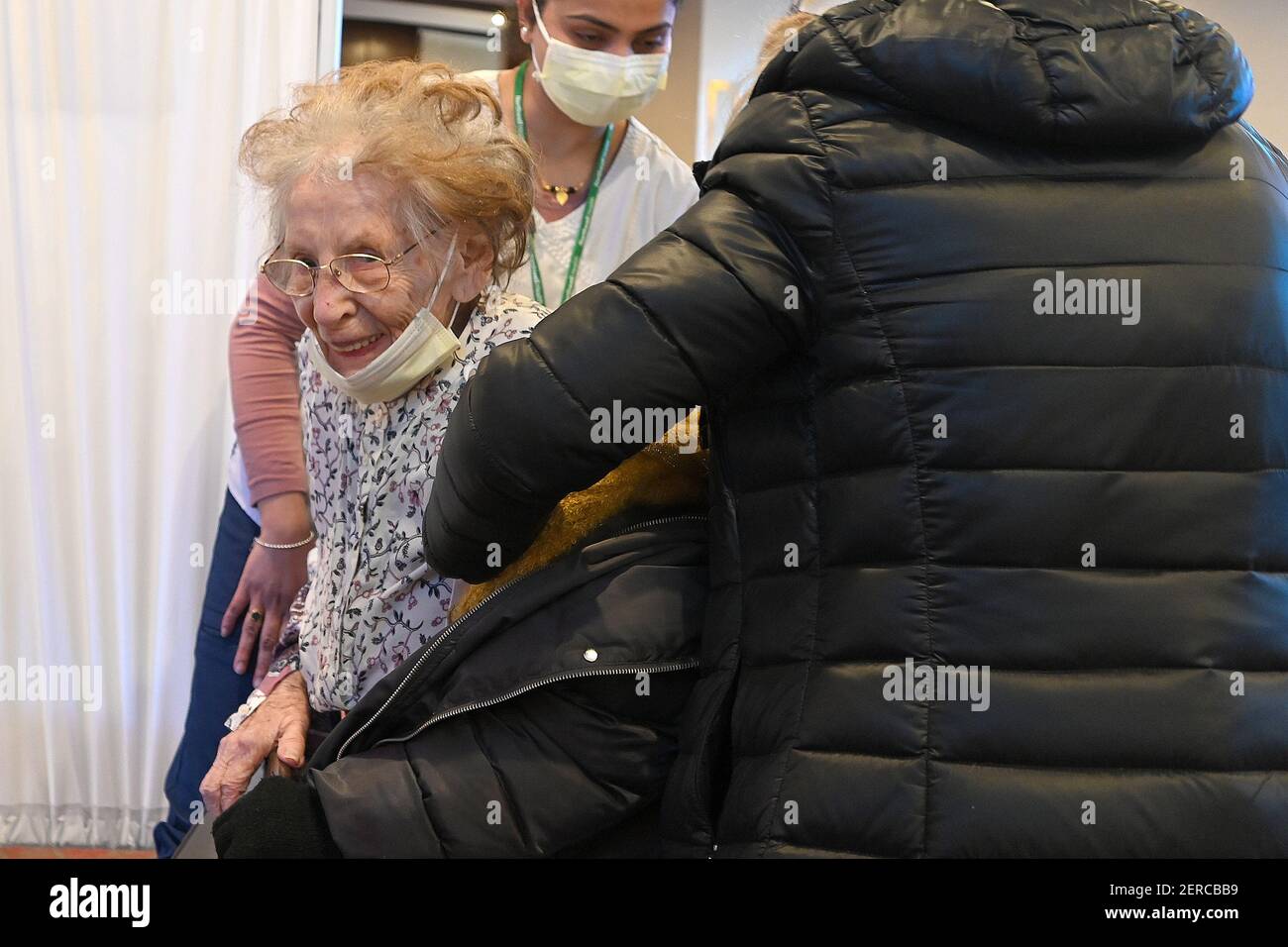 Holocaust survivor Bonnie Rybstein, 98, is assisted by her daughter as ...