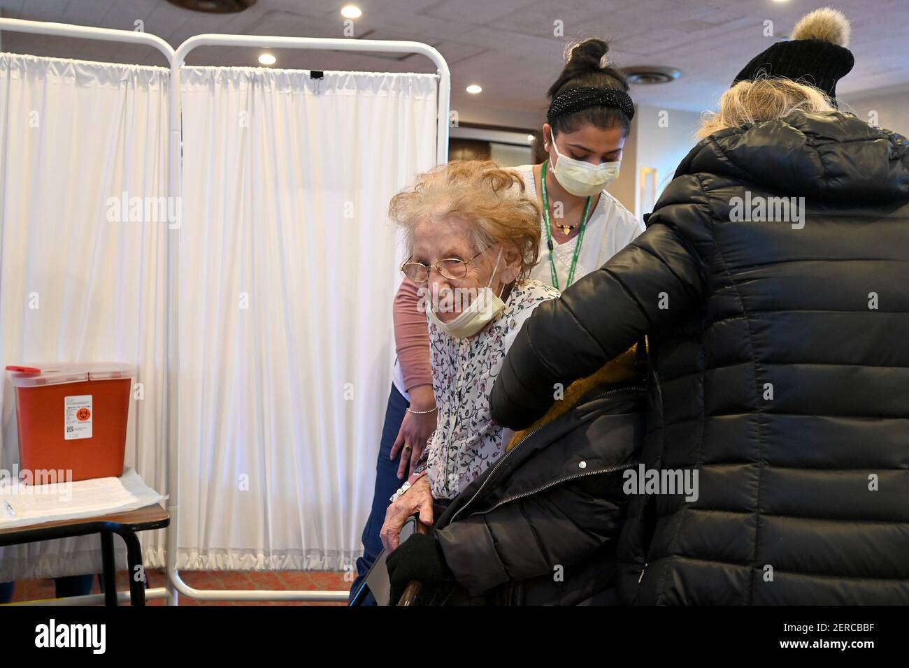 Holocaust survivor Bonnie Rybstein, 98, is assisted by her daughter as ...