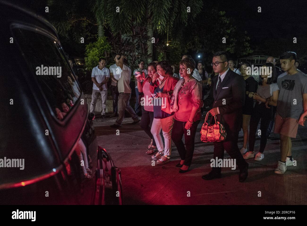 Family and mourners take part in the funeral procession of Tanauan ...