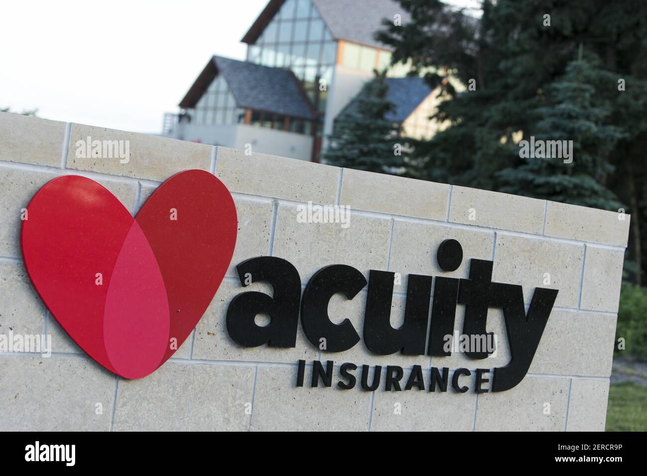 A logo sign outside of the headquarters of Acuity Insurance in ...