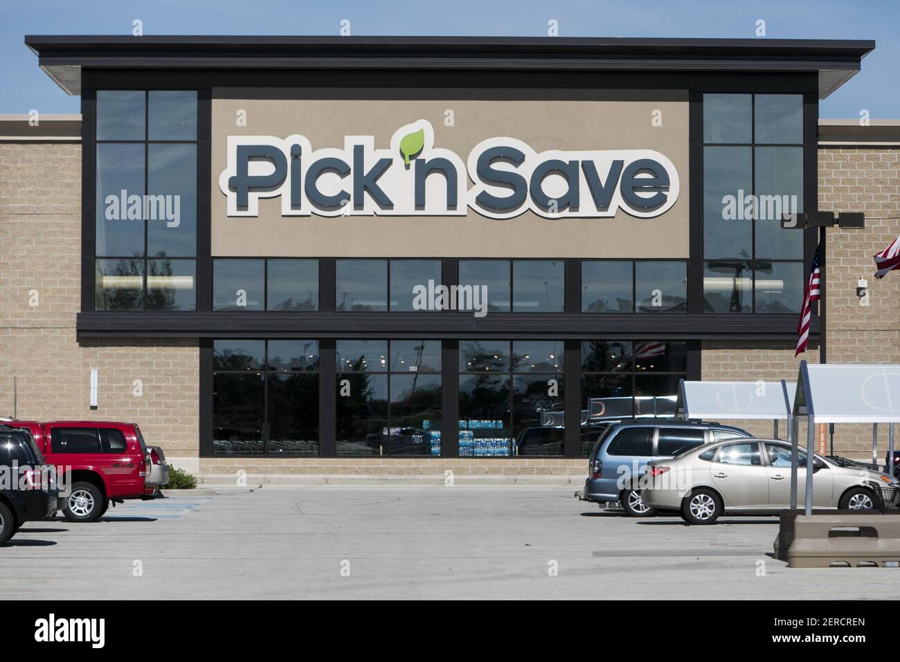 A logo sign outside of a Pick 'n Save retail grocery store in Racine ...