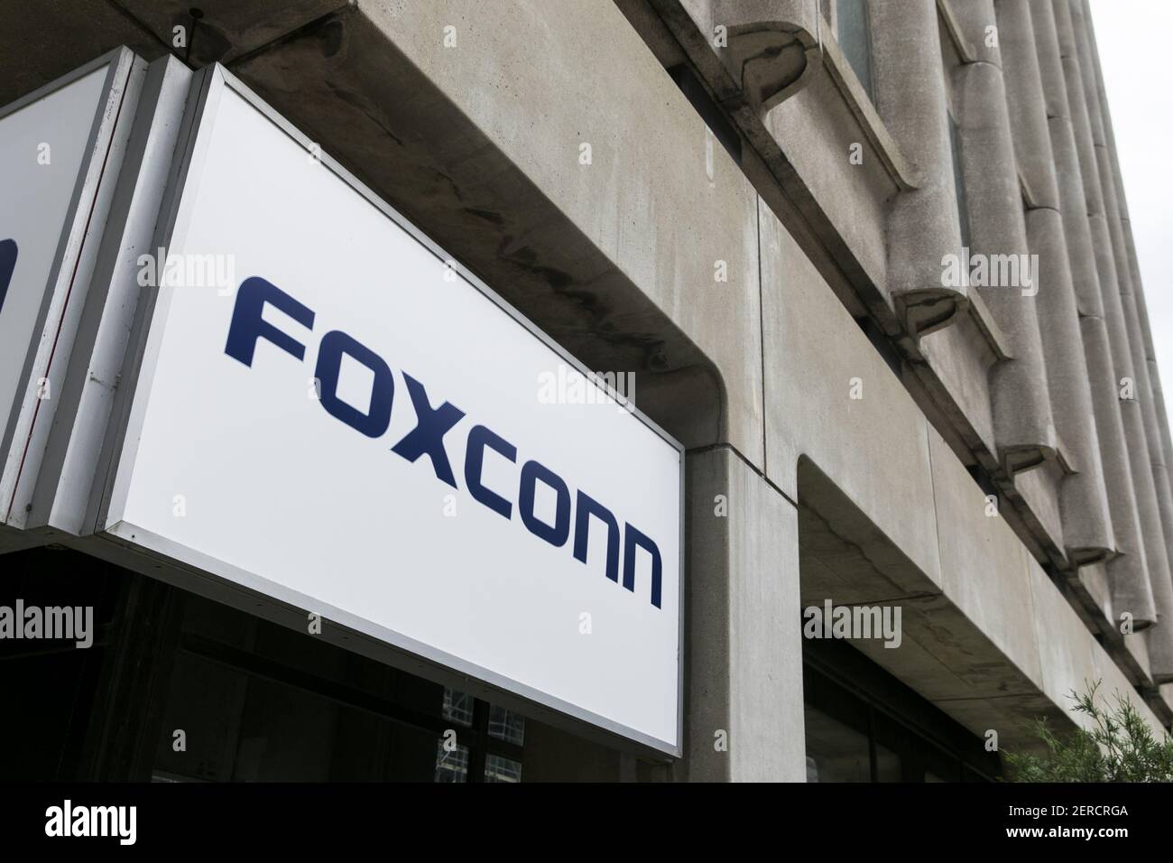 A logo sign outside of an office building occupied by Foxconn in ...