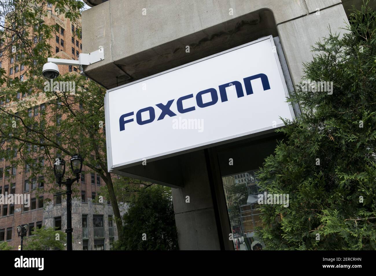 A logo sign outside of an office building occupied by Foxconn in ...