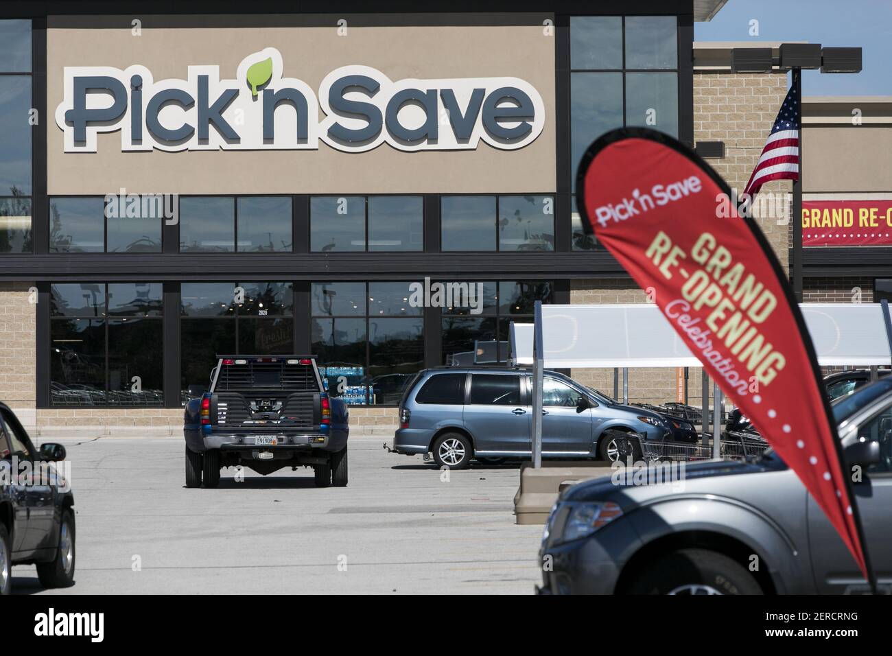 A logo sign outside of a Pick 'n Save retail grocery store in Racine ...