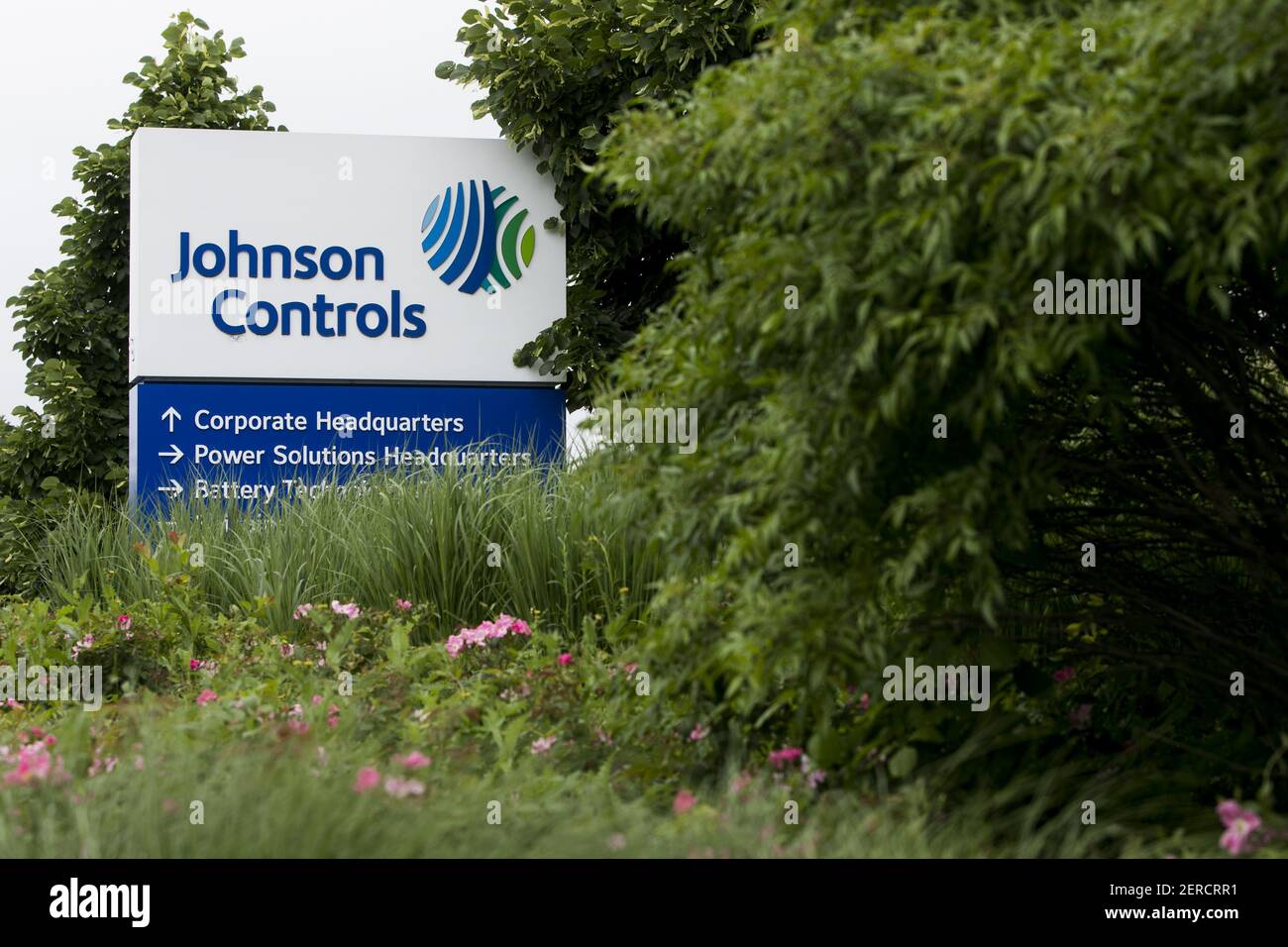 A logo sign outside of the headquarters of Johnson Controls in ...