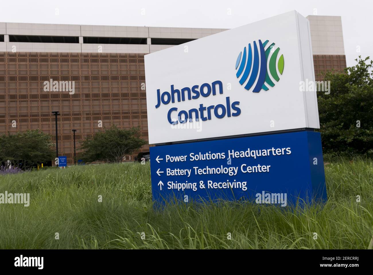 A logo sign outside of the headquarters of Johnson Controls in ...