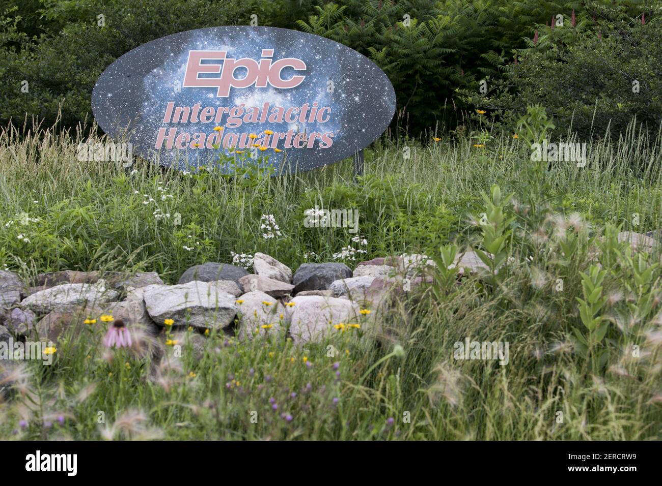 A logo sign outside of the headquarters of the Epic Systems Corporation ...