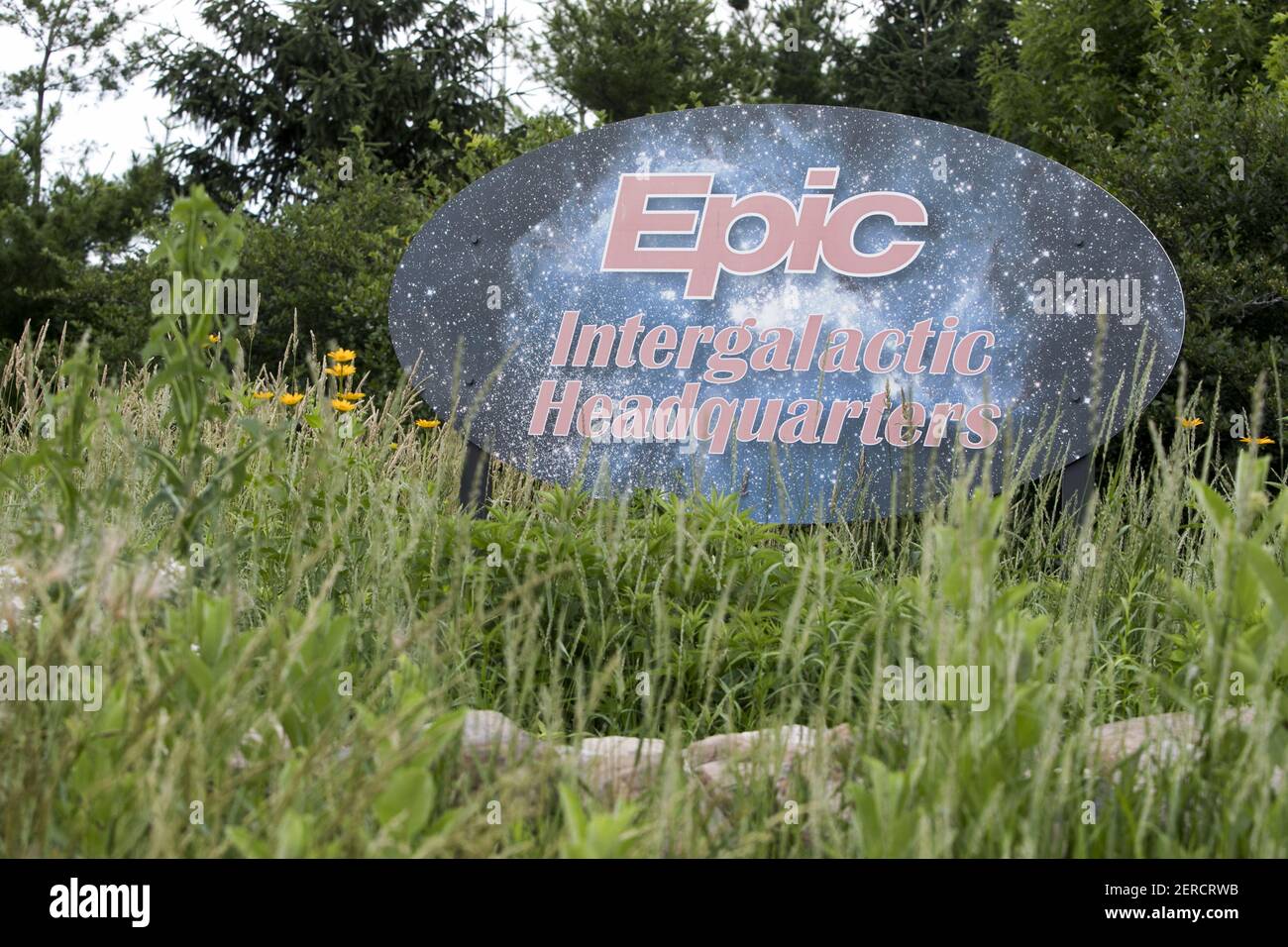 A logo sign outside of the headquarters of the Epic Systems Corporation ...