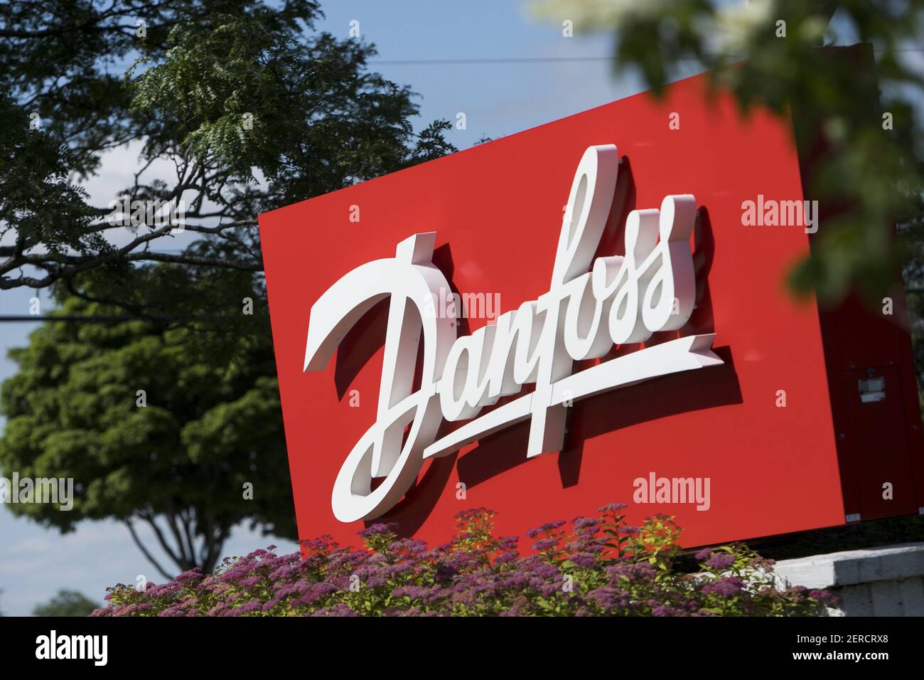 A logo sign outside of a facility occupied by The Danfoss Group in ...